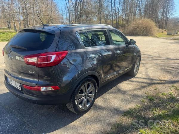 Grey Kia Sportage 2010 in Talsi, with an engine capacity of 2.00 L and mileage of 265 thousand km for 7500 €, photo 3 on AUTOMOTO.COM.LV