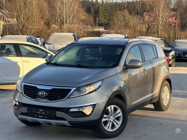 Grey Kia Sportage 2011 in Alytus, with an engine capacity of 1.69 L and mileage of 213 thousand km for 6680 €, photo 1 on AUTOMOTO.COM.LV