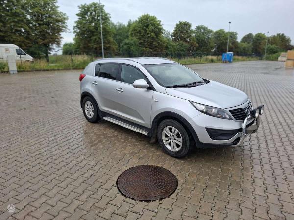 Grey Kia Sportage 2011 in Kaunas, with an engine capacity of 1.69 L and mileage of 325 thousand km for 4750 €, photo 6 on AUTOMOTO.COM.LV