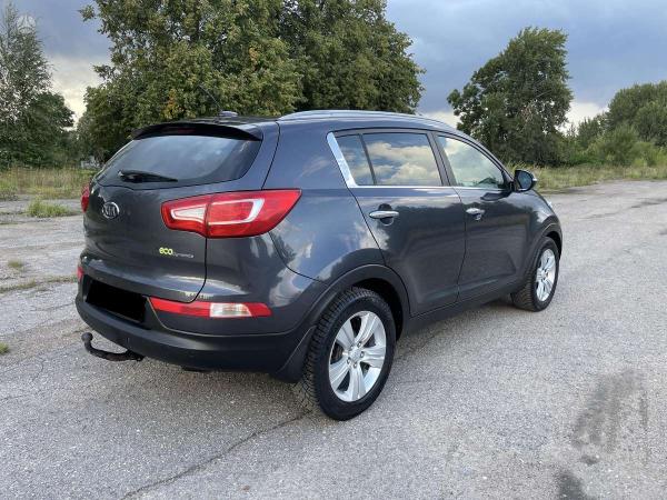 Grey Kia Sportage 2011 in Ukmerge, with an engine capacity of 1.69 L and mileage of 260 thousand km for 5500 €, photo 6 on AUTOMOTO.COM.LV