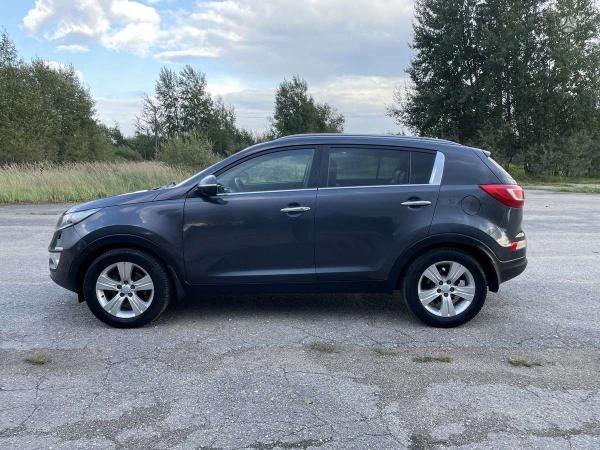 Grey Kia Sportage 2011 in Ukmerge, with an engine capacity of 1.69 L and mileage of 260 thousand km for 5500 €, photo 9 on AUTOMOTO.COM.LV
