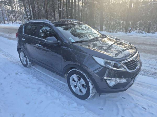 Grey Kia Sportage 2012 in Taurage, with an engine capacity of 2.00 L and mileage of 255 thousand km for 6400 €, photo 4 on AUTOMOTO.COM.LV