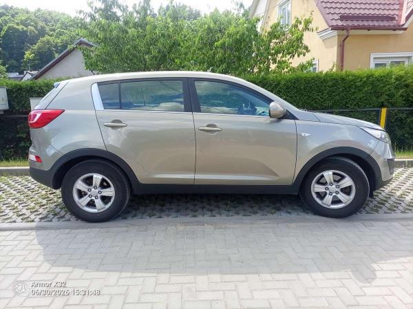 Grey Kia Sportage 2012 in Vilnius, with an engine capacity of 1.69 L and mileage of 217 thousand km for 6800 €, photo 2 on AUTOMOTO.COM.LV