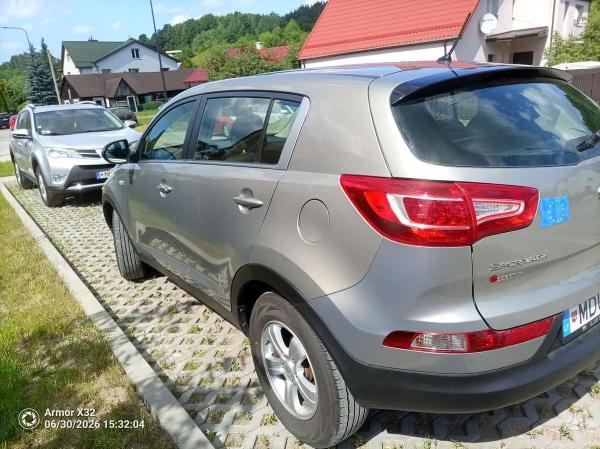 Grey Kia Sportage 2012 in Vilnius, with an engine capacity of 1.69 L and mileage of 217 thousand km for 6800 €, photo 4 on AUTOMOTO.COM.LV