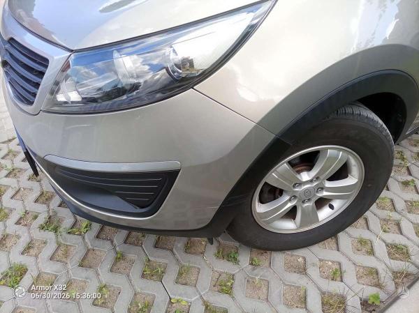 Grey Kia Sportage 2012 in Vilnius, with an engine capacity of 1.69 L and mileage of 217 thousand km for 6800 €, photo 5 on AUTOMOTO.COM.LV