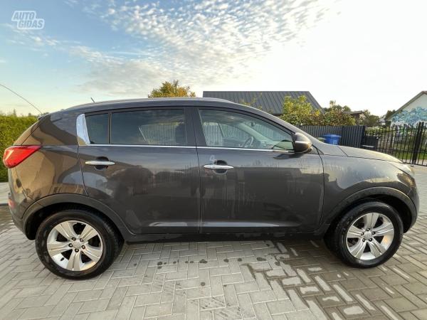 Grey Kia Sportage 2013 in Alytus, with an engine capacity of 1.70 L and mileage of 318 thousand km for 6600 €, photo 1 on AUTOMOTO.COM.LV