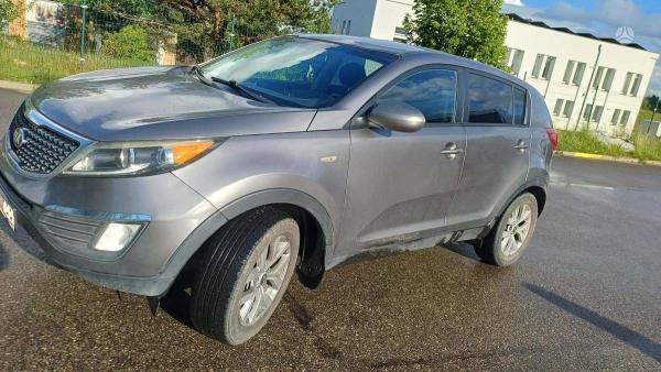 Grey Kia Sportage 2015 in Trakai, with an engine capacity of 2.36 L and mileage of 99 thousand km for 7500 €, photo 1 on AUTOMOTO.COM.LV