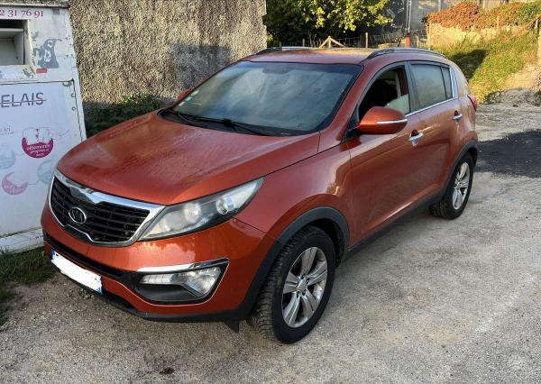 Orange Kia Sportage 2011 in Taurage, with an engine capacity of 1.69 L and mileage of 218 thousand km for 3800 €, photo 6 on AUTOMOTO.COM.LV