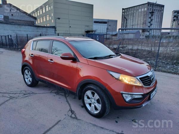Oranžs Kia Sportage 2013 Rīga, ar dzinēja tilpumu 2.00 L un nobraukumu 247 tūkst. km par 6700 €, foto 1 vietnē AUTOMOTO.COM.LV