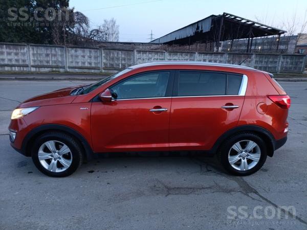 Oranžs Kia Sportage 2013 Rīga, ar dzinēja tilpumu 2.00 L un nobraukumu 247 tūkst. km par 6700 €, foto 4 vietnē AUTOMOTO.COM.LV