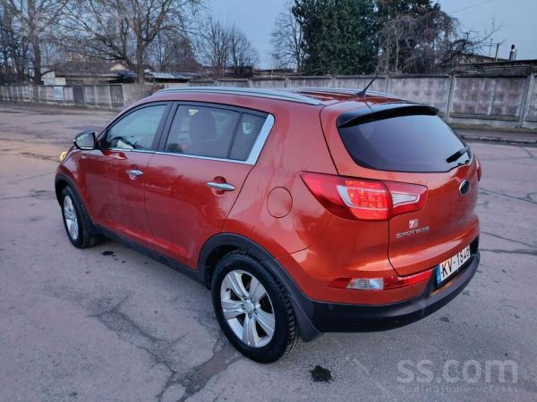 Oranžs Kia Sportage 2013 Rīga, ar dzinēja tilpumu 2.00 L un nobraukumu 247 tūkst. km par 6700 €, foto 5 vietnē AUTOMOTO.COM.LV