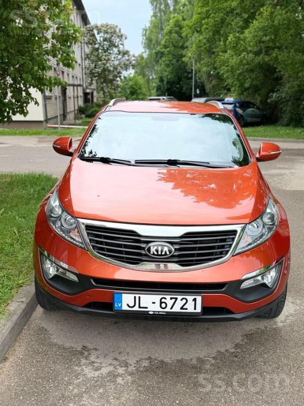 Oranžs Kia Sportage 2013 Daugavpils, ar dzinēja tilpumu 2.00 L un nobraukumu 122 tūkst. km par 8700 €, foto 1 vietnē AUTOMOTO.COM.LV