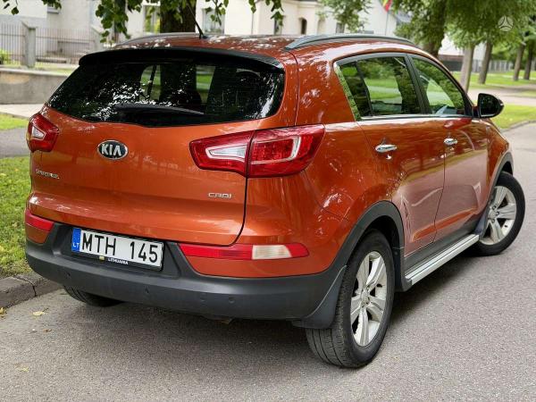 Orange Kia Sportage 2013 in Kaunas, with an engine capacity of 2.00 L and mileage of 207 thousand km for 6300 €, photo 3 on AUTOMOTO.COM.LV