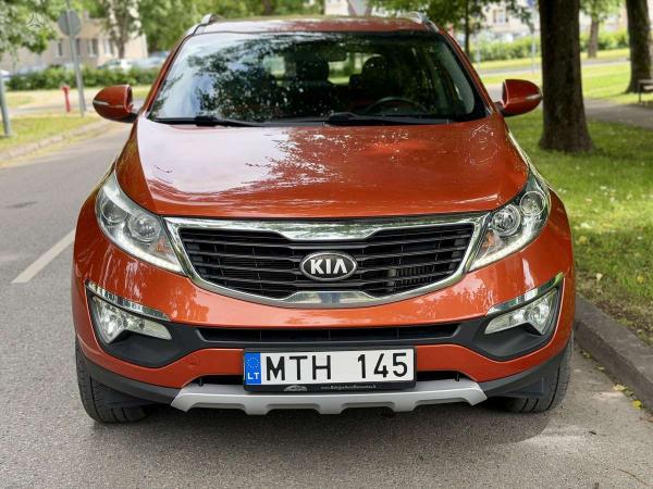 Orange Kia Sportage 2013 in Kaunas, with an engine capacity of 2.00 L and mileage of 207 thousand km for 6300 €, photo 5 on AUTOMOTO.COM.LV