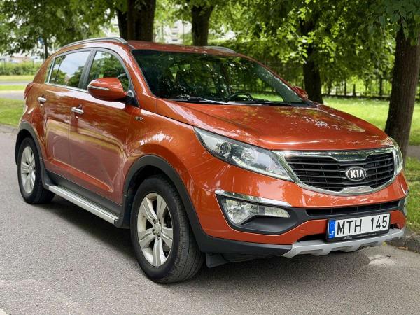 Orange Kia Sportage 2013 in Kaunas, with an engine capacity of 2.00 L and mileage of 207 thousand km for 6300 €, photo 7 on AUTOMOTO.COM.LV