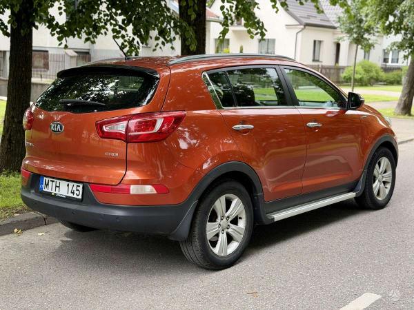 Orange Kia Sportage 2013 in Kaunas, with an engine capacity of 2.00 L and mileage of 207 thousand km for 6300 €, photo 8 on AUTOMOTO.COM.LV