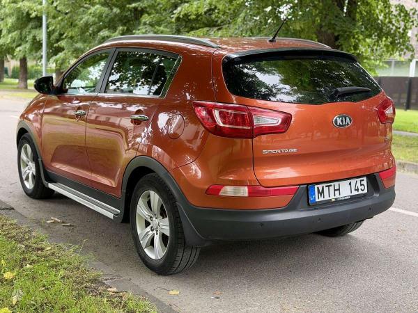 Orange Kia Sportage 2013 in Kaunas, with an engine capacity of 2.00 L and mileage of 207 thousand km for 6300 €, photo 10 on AUTOMOTO.COM.LV