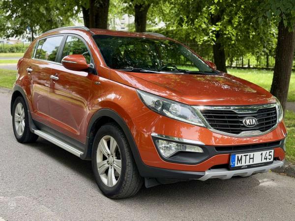 Orange Kia Sportage 2013 in Kaunas, with an engine capacity of 2.00 L and mileage of 207 thousand km for 4950 €, photo 9 on AUTOMOTO.COM.LV