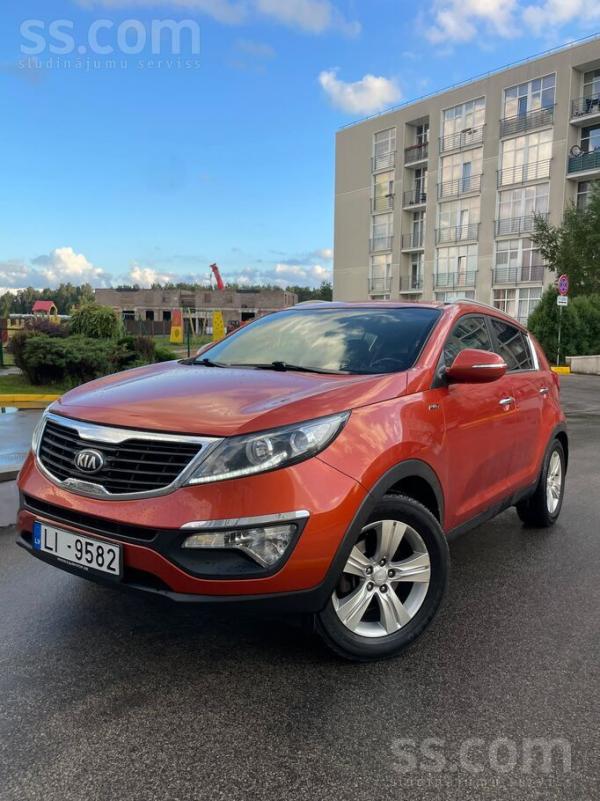 Orange Kia Sportage 2013 in Riga, with an engine capacity of 2.00 L and mileage of 186 thousand km for 6700 €, photo 2 on AUTOMOTO.COM.LV