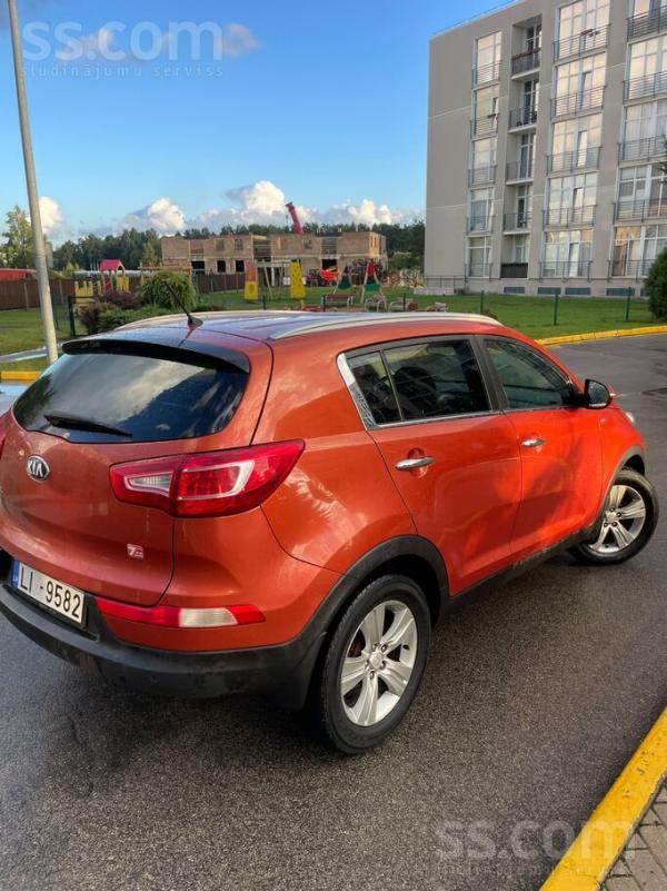 Orange Kia Sportage 2013 in Riga, with an engine capacity of 2.00 L and mileage of 186 thousand km for 6700 €, photo 3 on AUTOMOTO.COM.LV