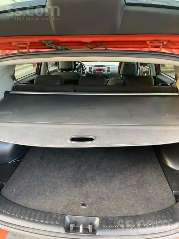 Orange Kia Sportage 2013 in Riga, with an engine capacity of 2.00 L and mileage of 186 thousand km for 6700 €, photo 5 on AUTOMOTO.COM.LV