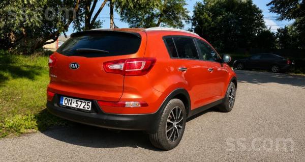 Orange Kia Sportage 2014 in Riga, with an engine capacity of 2.00 L and mileage of 190 thousand km for 8100 €, photo 2 on AUTOMOTO.COM.LV
