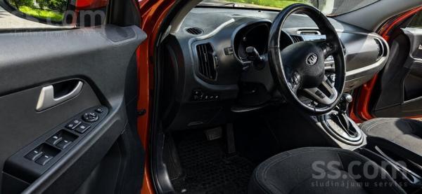 Orange Kia Sportage 2014 in Riga, with an engine capacity of 2.00 L and mileage of 190 thousand km for 8100 €, photo 7 on AUTOMOTO.COM.LV
