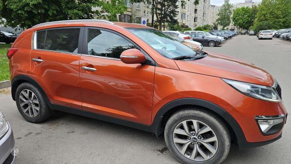 Orange Kia Sportage 2015 in Kaunas, with an engine capacity of 2.00 L and mileage of 104 thousand km for 9700 €, photo 3 on AUTOMOTO.COM.LV