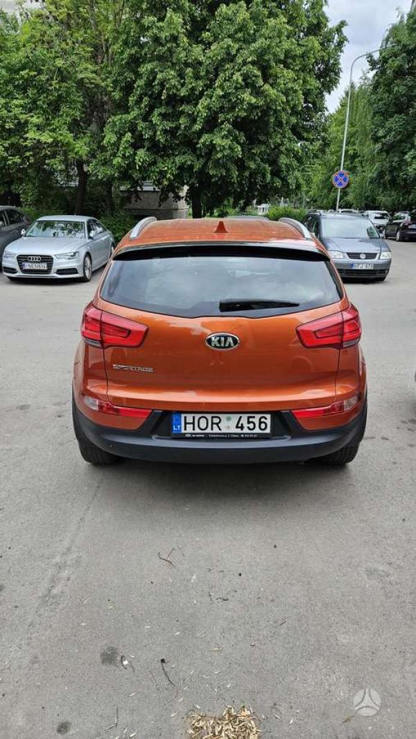 Orange Kia Sportage 2015 in Kaunas, with an engine capacity of 2.00 L and mileage of 104 thousand km for 9700 €, photo 4 on AUTOMOTO.COM.LV