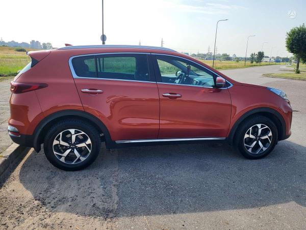 Orange Kia Sportage 2019 in Kaunas, with an engine capacity of 1.59 L and mileage of 85 thousand km for 13900 €, photo 4 on AUTOMOTO.COM.LV