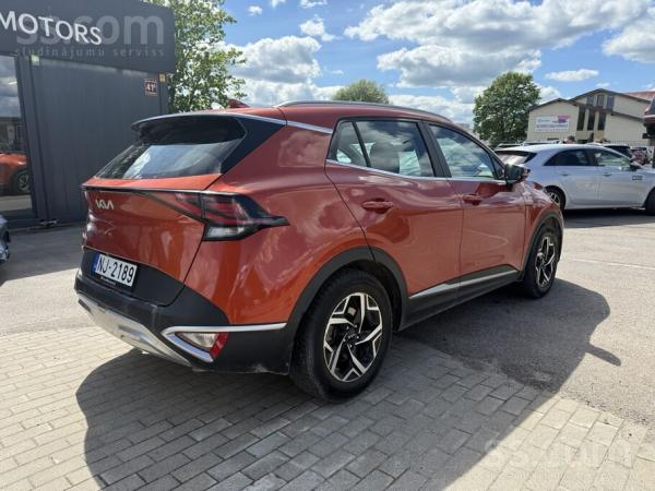 Orange Kia Sportage 2023 in Jelgava, with an engine capacity of 1.60 L and mileage of 103 thousand km for 20500 €, photo 6 on AUTOMOTO.COM.LV