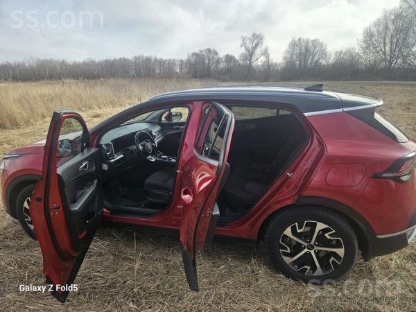 Red Kia Sportage 2022 in Riga, with an engine capacity of 1.60 L and mileage of 72 thousand km for 22500 €, photo 7 on AUTOMOTO.COM.LV