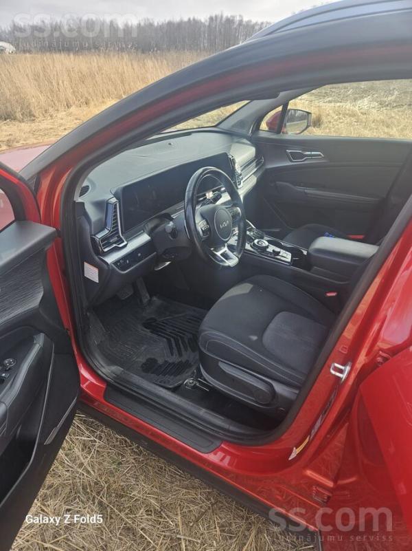 Red Kia Sportage 2022 in Riga, with an engine capacity of 1.60 L and mileage of 72 thousand km for 22500 €, photo 9 on AUTOMOTO.COM.LV