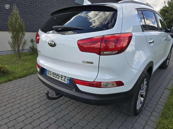 White Kia Sportage 2015 in Rokiskis, with an engine capacity of 1.69 L and mileage of 300 thousand km for 6200 €, photo 8 on AUTOMOTO.COM.LV