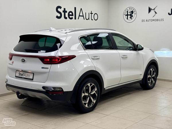White Kia Sportage 2021 in Vilnius, with an engine capacity of 1.60 L and mileage of 75 thousand km for 17600 €, photo 5 on AUTOMOTO.COM.LV