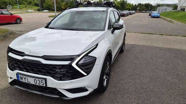 White Kia Sportage 2022 in Vilnius, with an engine capacity of 1.60 L and mileage of 67 thousand km for 25900 €, photo 7 on AUTOMOTO.COM.LV