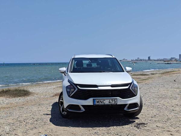 White Kia Sportage 2023 in Vilnius, with an engine capacity of 1.60 L and mileage of 73 thousand km for 20000 €, photo 10 on AUTOMOTO.COM.LV