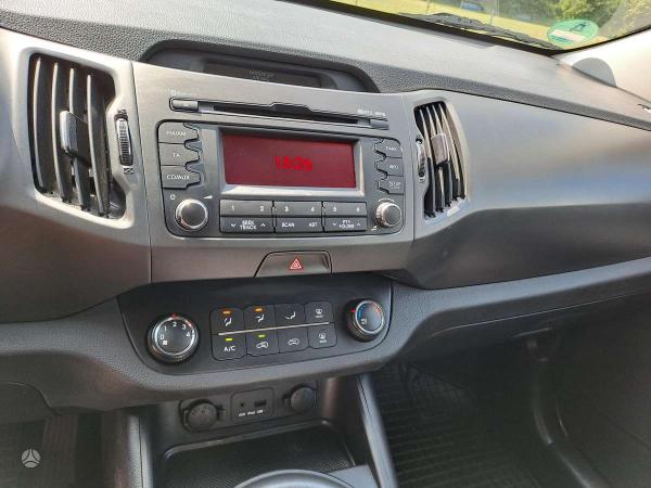 Yellow Kia Sportage 2012 in Prienai, with an engine capacity of 1.69 L and mileage of 169 thousand km for 6400 €, photo 8 on AUTOMOTO.COM.LV
