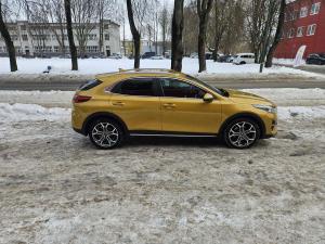 Yellow Kia XCeed 2021 in Klaipeda, with an engine capacity of 1.48 L and mileage of 86 thousand km for 18900 €, photo 2 on AUTOMOTO.COM.LV