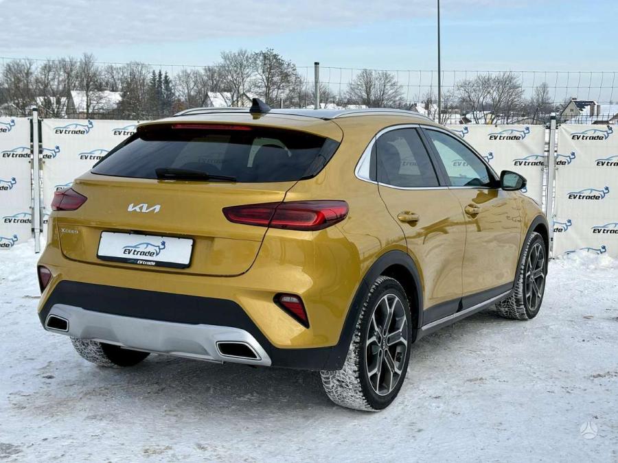 Yellow Kia XCeed 2022 in Vilnius, with an engine capacity of 1.58 L and mileage of 155 thousand km for 16999 €, photo 2 on AUTOMOTO.COM.LV
