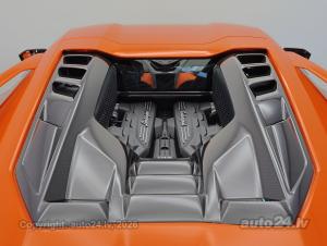 Orange Lamborghini Revuelto 2026 in Tallinn, with an engine capacity of 6.50 L and mileage of 0 thousand km for 657076 €, photo 21 on AUTOMOTO.COM.LV