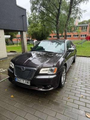 Brūns Lancia Thema 2013 Tallina, ar dzinēja tilpumu 2.99 L un nobraukumu 270 tūkst. km par 6490 €, foto  vietnē AUTOMOTO.COM.LV