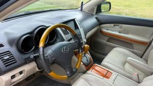 Black Lexus RX 400h 2010 in Riga, with an engine capacity of 3.30 L and mileage of 333 thousand km for 4700 €, photo 13 on AUTOMOTO.COM.LV