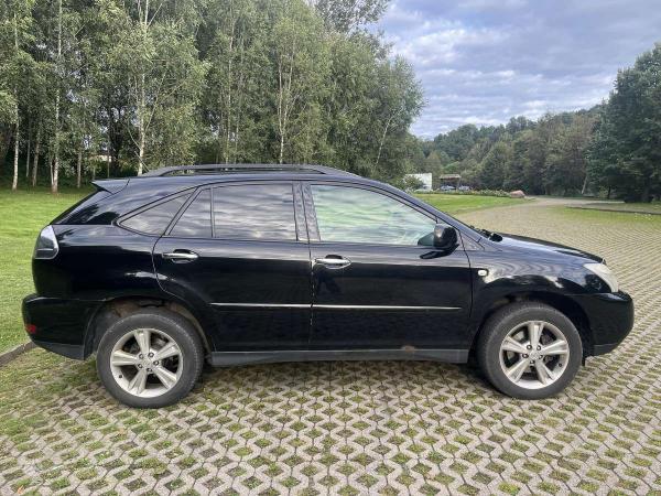 Black Lexus RX 400h 2010 in Vilnius, with an engine capacity of 3.31 L and mileage of 324 thousand km for 4500 €, photo 9 on AUTOMOTO.COM.LV