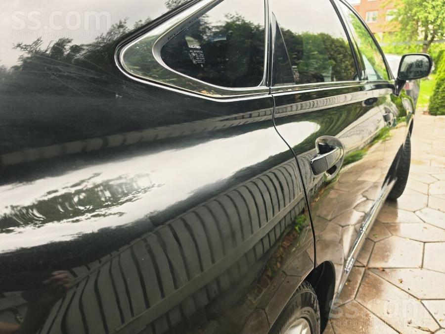 Black Lexus RX 2010 in Riga, with an engine capacity of 3.50 L and mileage of 270 thousand km for 6900 €, photo 7 on AUTOMOTO.COM.LV