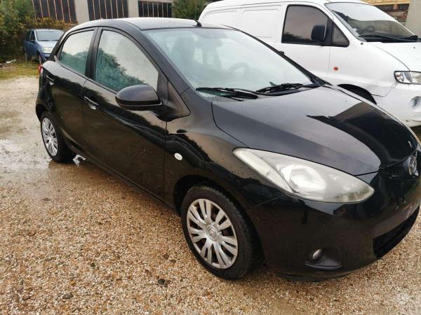 Black Mazda 2 2009 in Panevezys, with an engine capacity of 1.40 L and mileage of 240 thousand km for 2350 €, photo 1 on AUTOMOTO.COM.LV