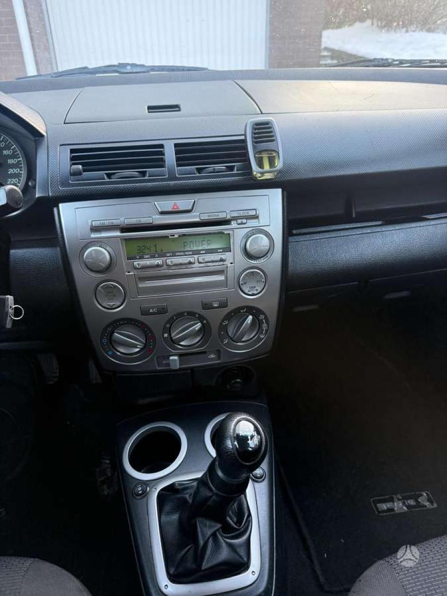 Green Mazda 2 2007 in Vilnius, with an engine capacity of 1.39 L and mileage of 218 thousand km for 1750 €, photo 14 on AUTOMOTO.COM.LV