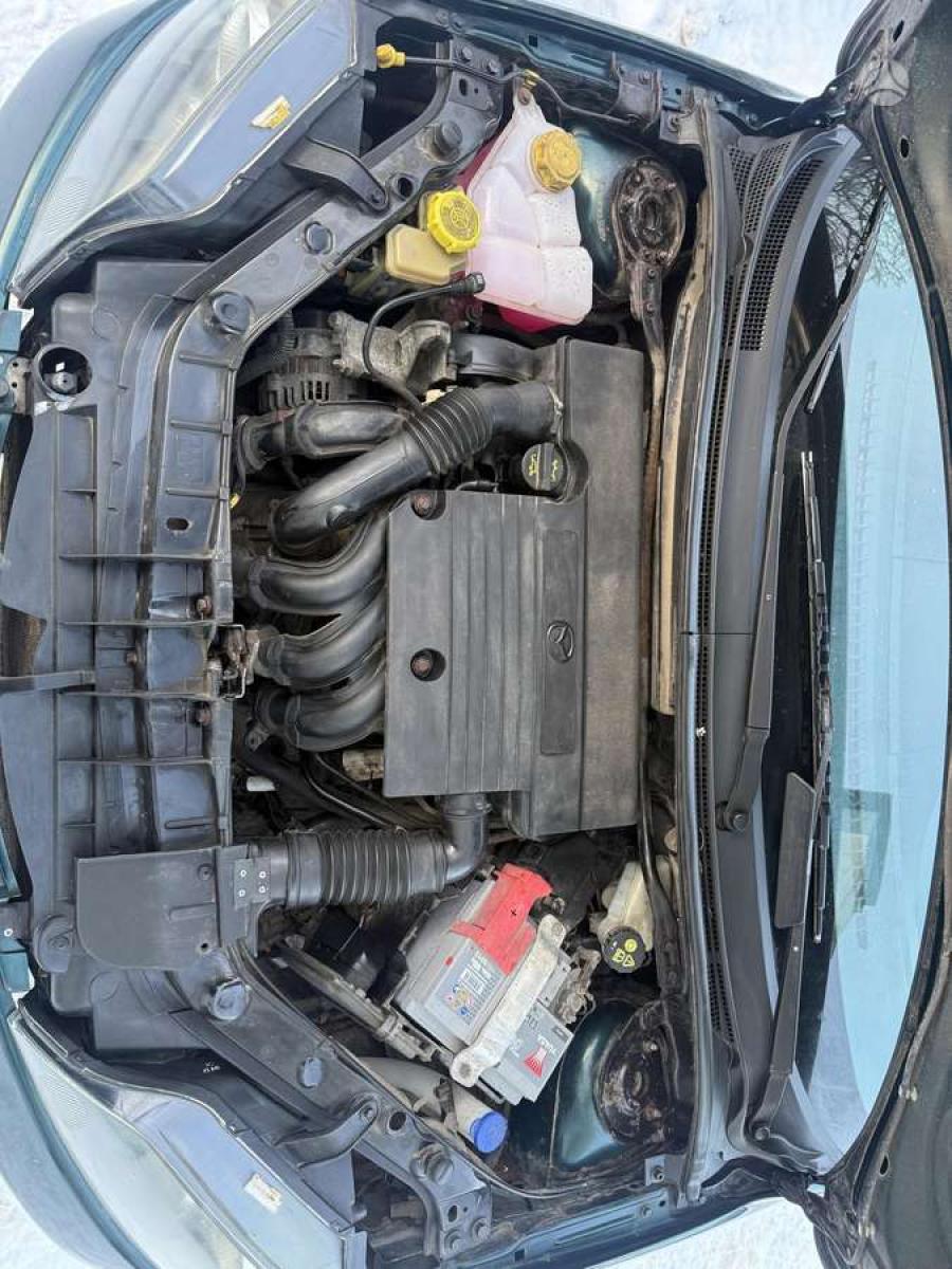 Green Mazda 2 2007 in Vilnius, with an engine capacity of 1.39 L and mileage of 218 thousand km for 1750 €, photo 16 on AUTOMOTO.COM.LV