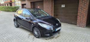 Red Mazda 2 2009 in Vilnius, with an engine capacity of 1.35 L and mileage of 320 thousand km for 499 €, photo 5 on AUTOMOTO.COM.LV