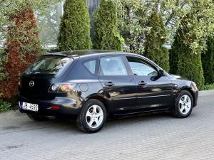 Black Mazda 3 2005 in Riga, with an engine capacity of 1.60 L and mileage of 291 thousand km for 1650 €, photo 4 on AUTOMOTO.COM.LV